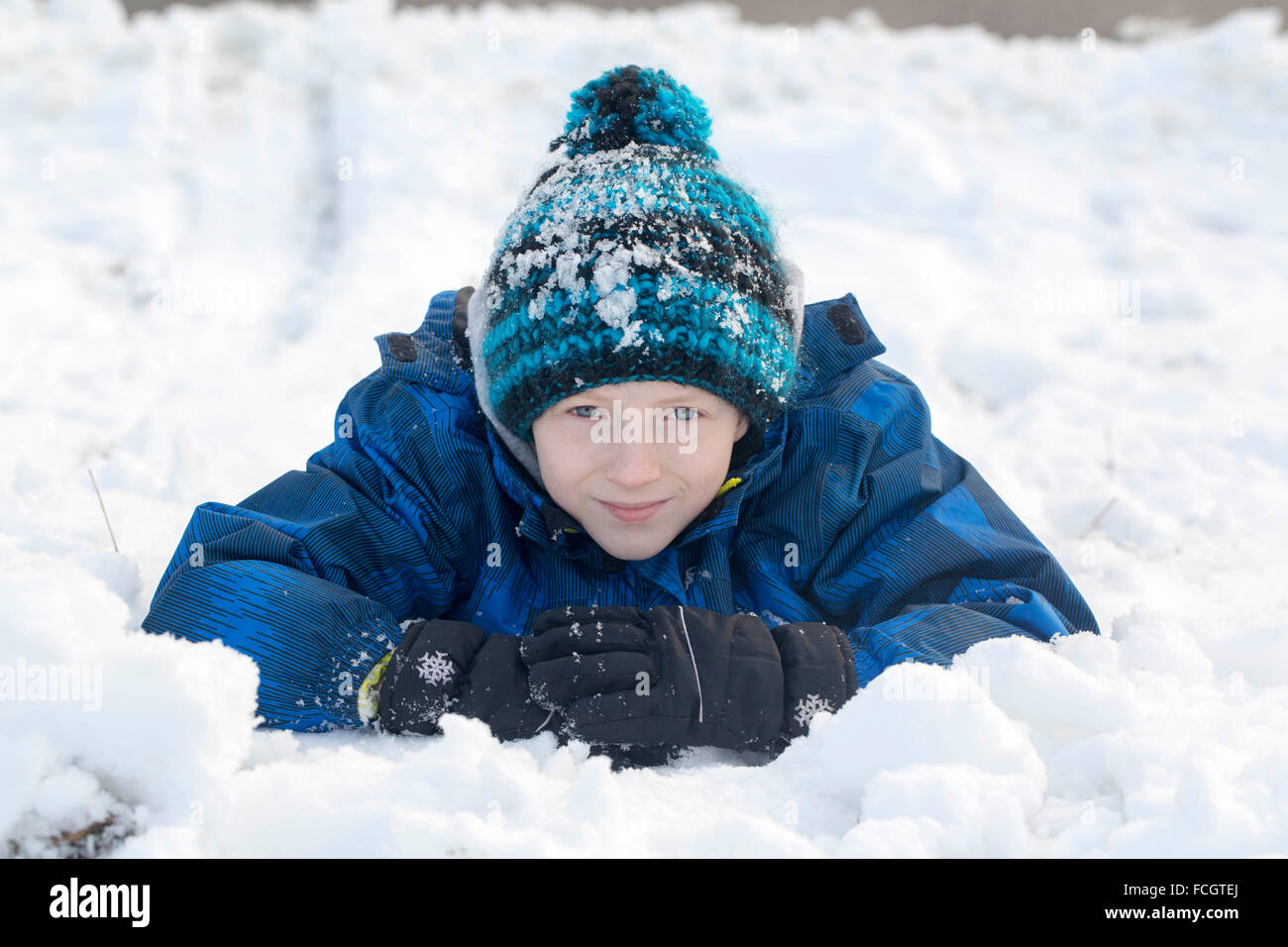Portrait of smiling boy bobble hat in snow Stock Photo - Alamy