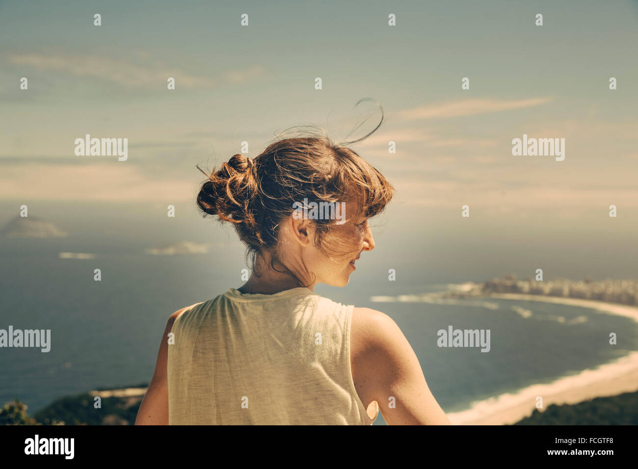 Brazil Woman looking down onto Copacabana of Rio de Janeiro from ...