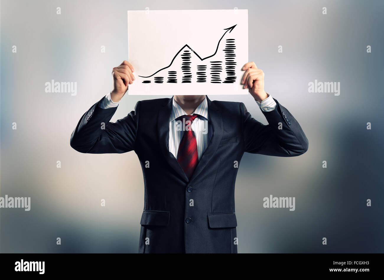 Businessman hiding his face behind paper sheet with sketches Stock ...