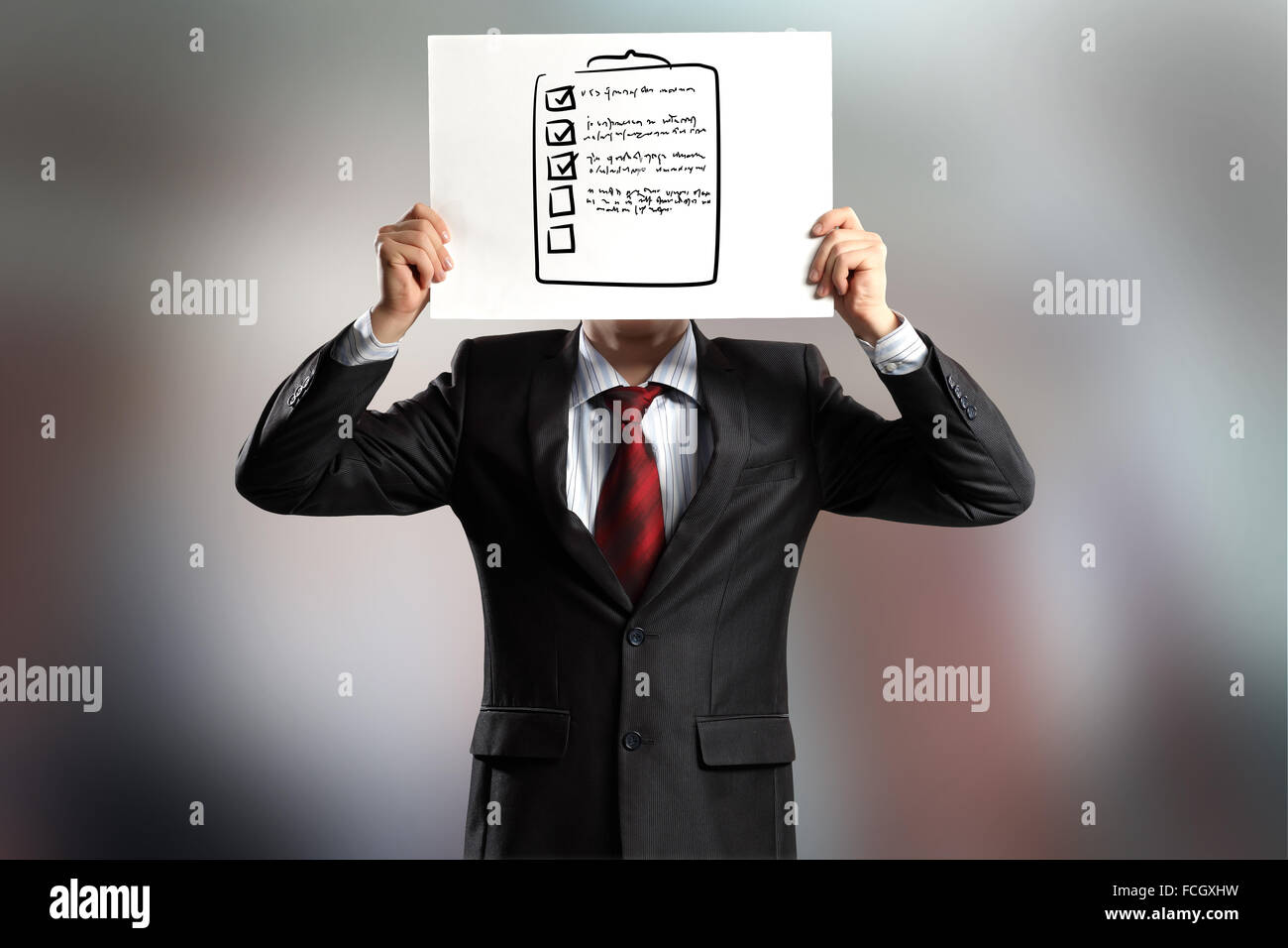 Businessman hiding his face behind paper sheet with sketches Stock ...