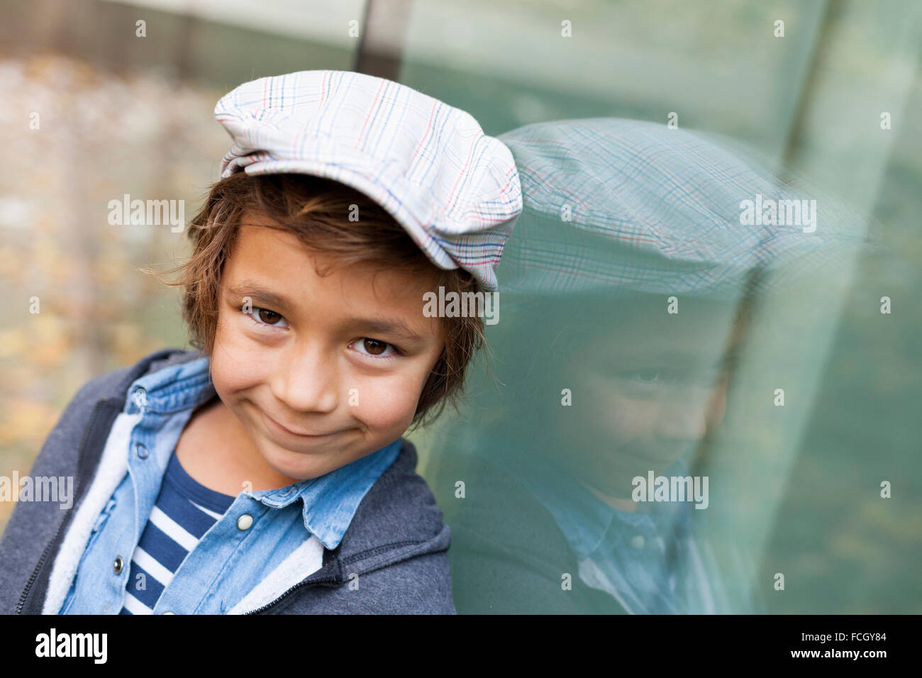 Portrait of smiling little boy wearing cap Stock Photo - Alamy