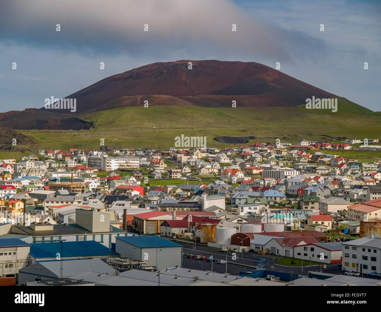Eldfell volcano in front of cityscape in Heimaey, Vestmannaeyjar ...