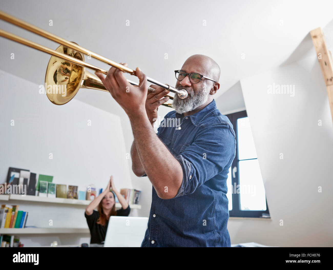 Woman playing trombone hi-res stock photography and images - Alamy