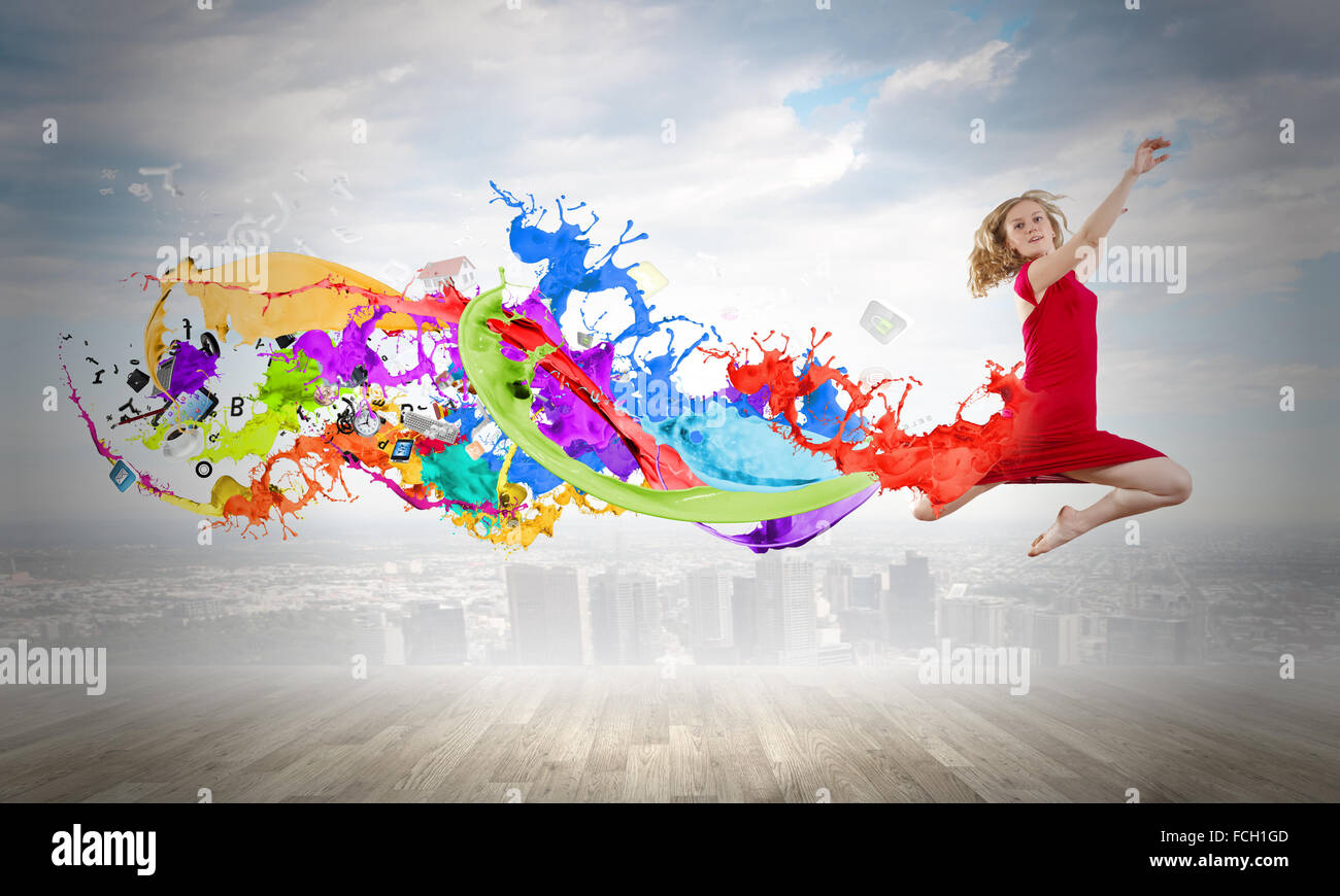 Young woman dancer in red dress jumping high Stock Photo - Alamy