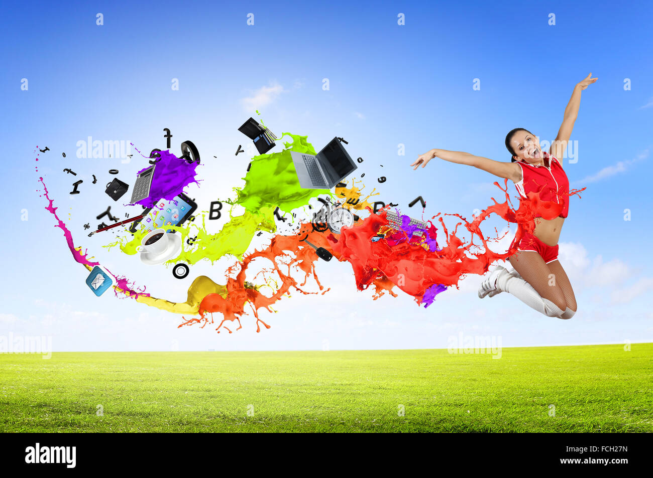 Young woman dancer in red suit jumping high Stock Photo - Alamy