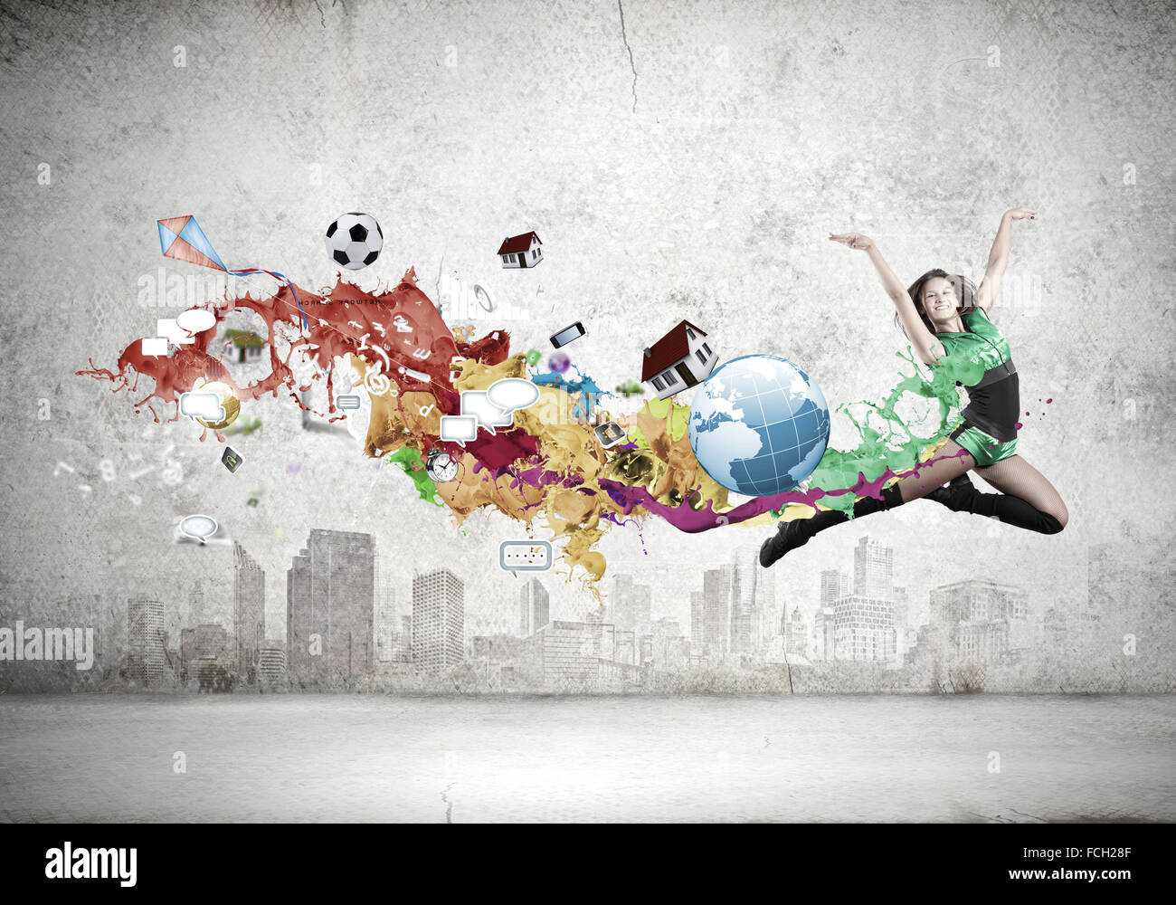 Young woman dancer in green suit jumping high Stock Photo - Alamy