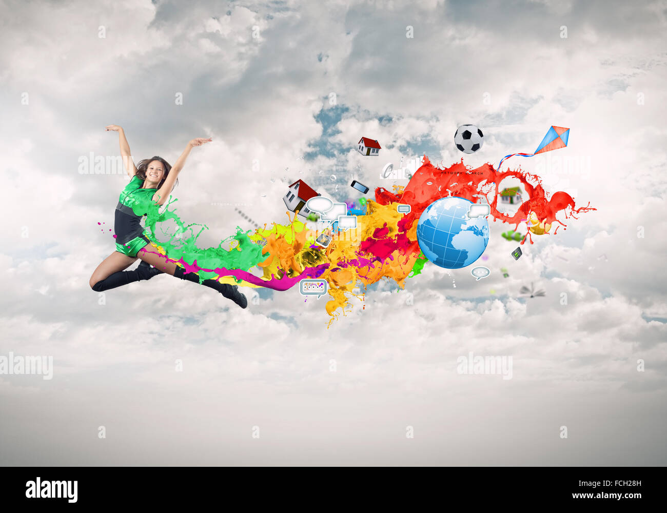 Young woman dancer in green suit jumping high Stock Photo - Alamy