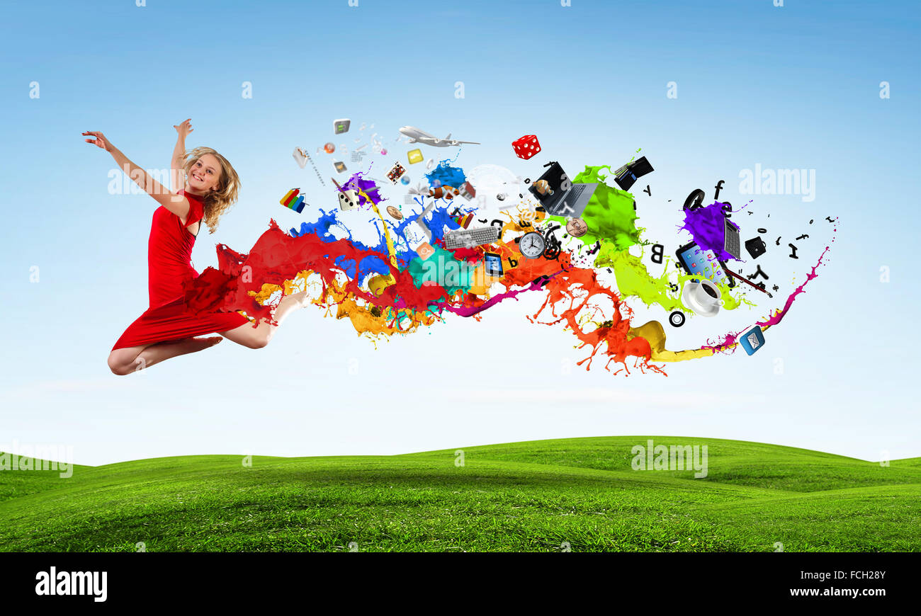 Young woman dancer in red dress jumping high Stock Photo - Alamy