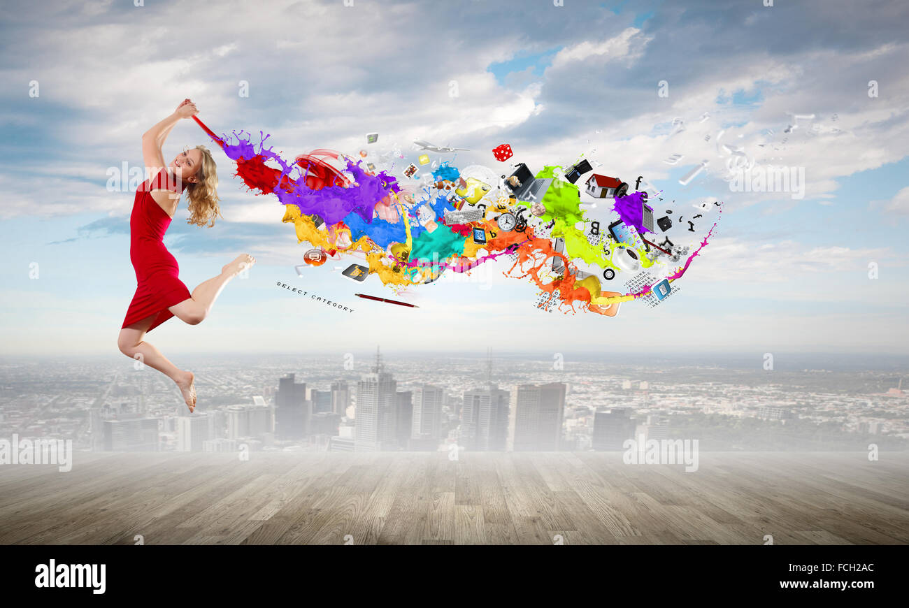 Young woman dancer in red dress jumping high Stock Photo - Alamy