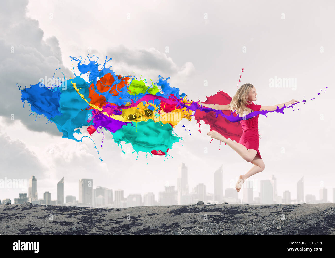 Young woman dancer in red dress jumping high Stock Photo - Alamy