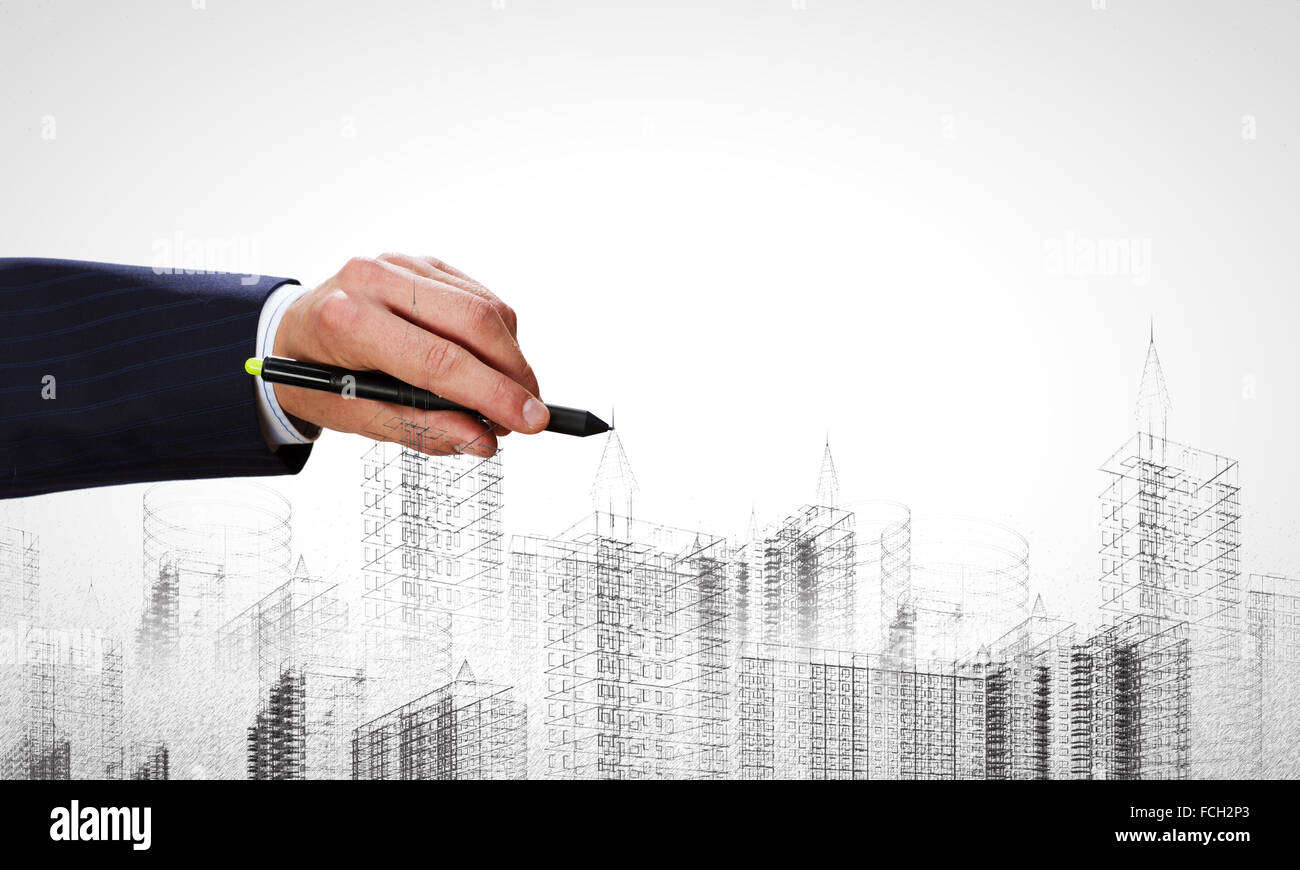 Close up of human hand drawing construction project Stock Photo - Alamy