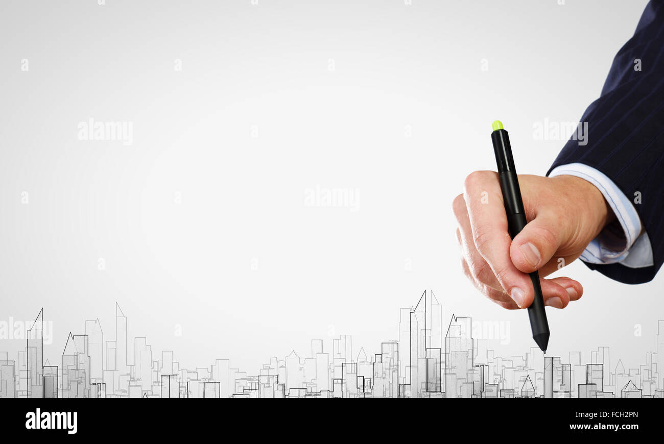 Close up of human hand drawing construction project Stock Photo - Alamy