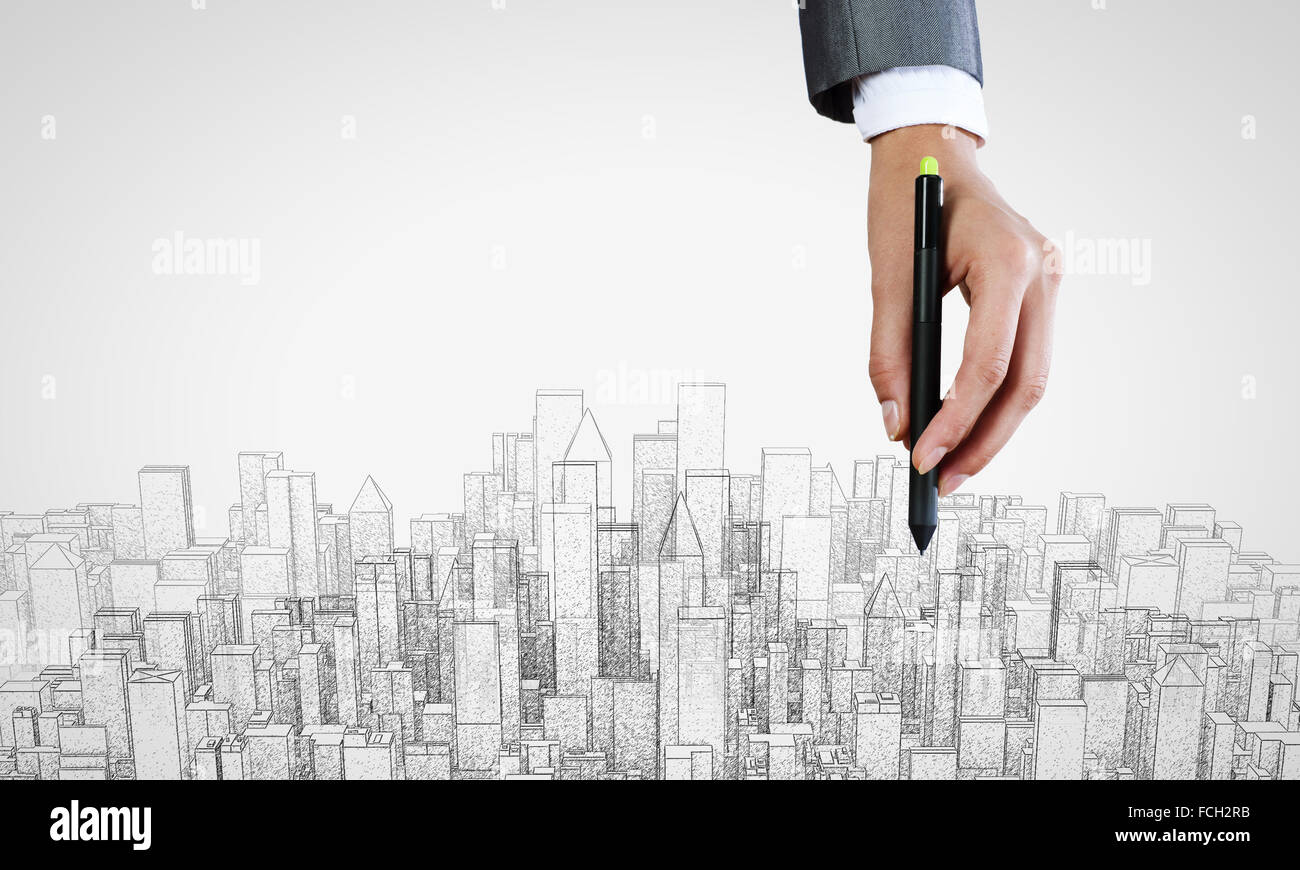Close up of human hand drawing construction project Stock Photo - Alamy