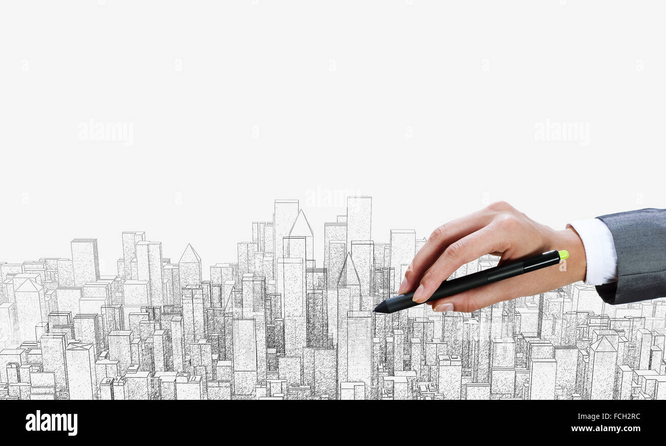 Close up of human hand drawing construction project Stock Photo - Alamy