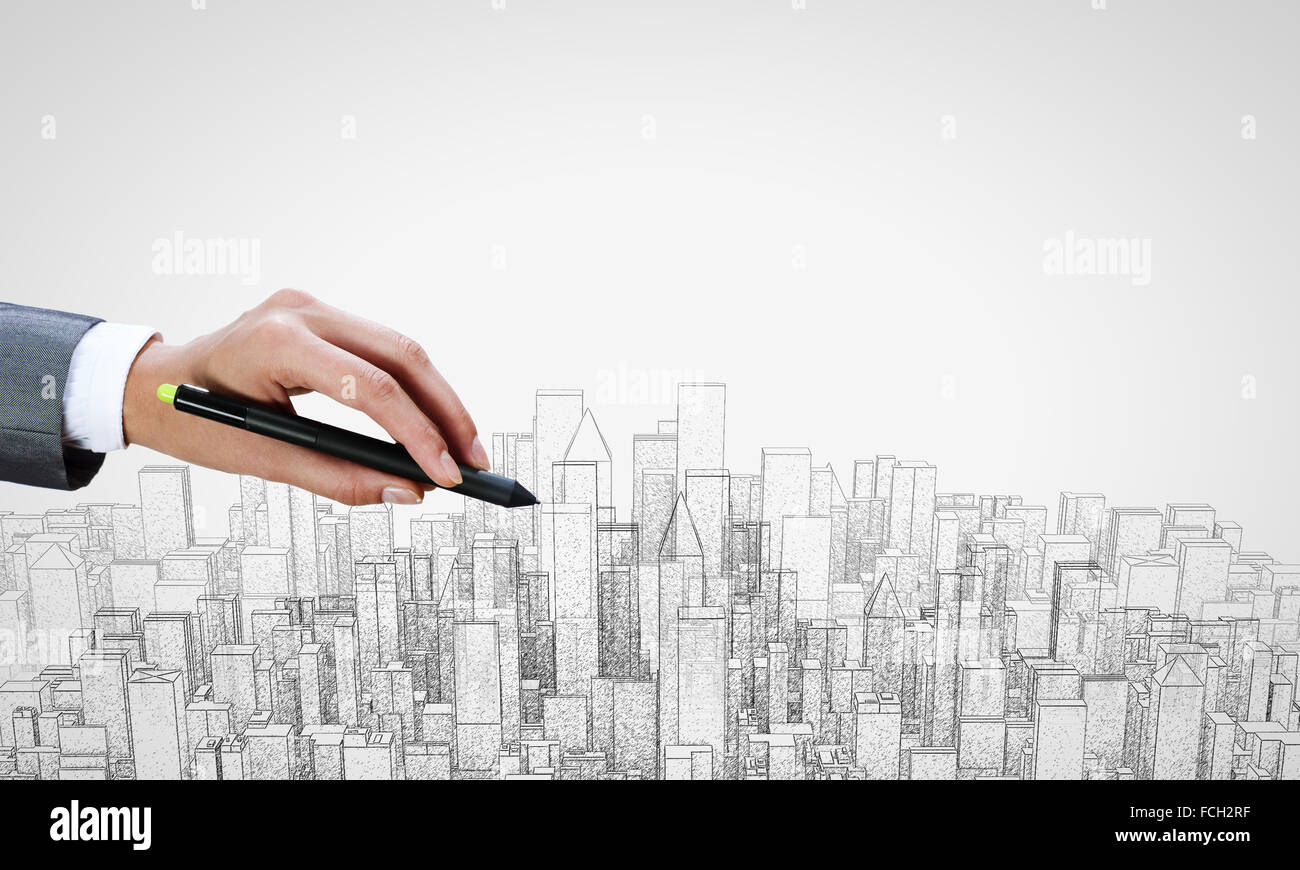 Close up of human hand drawing construction project Stock Photo - Alamy