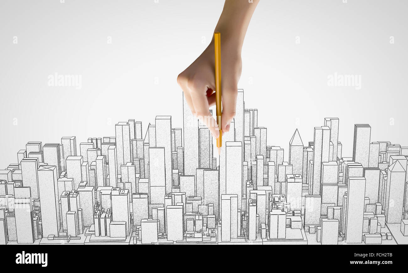 Close up of human hand drawing construction project Stock Photo - Alamy