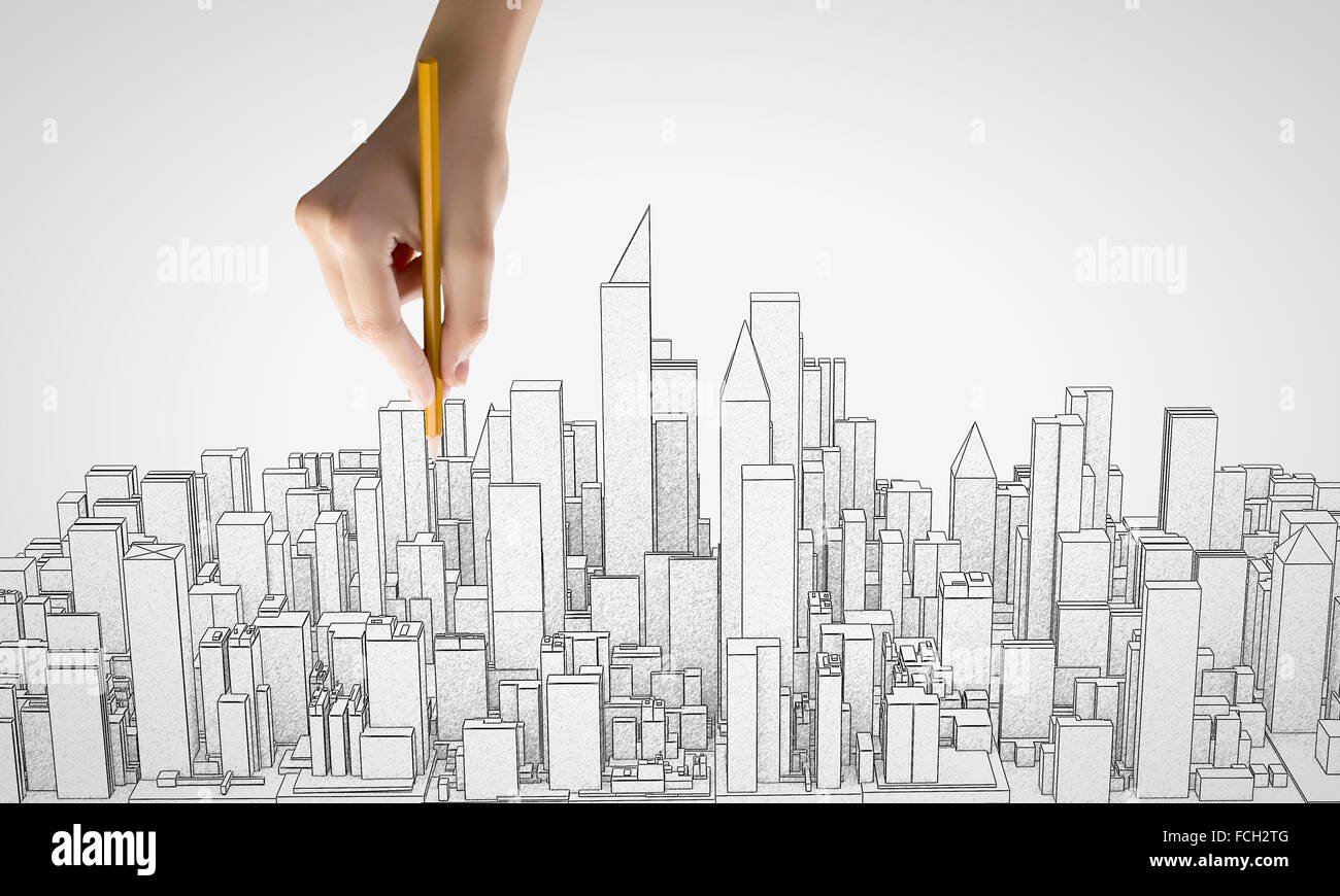 Close up of human hand drawing construction project Stock Photo - Alamy