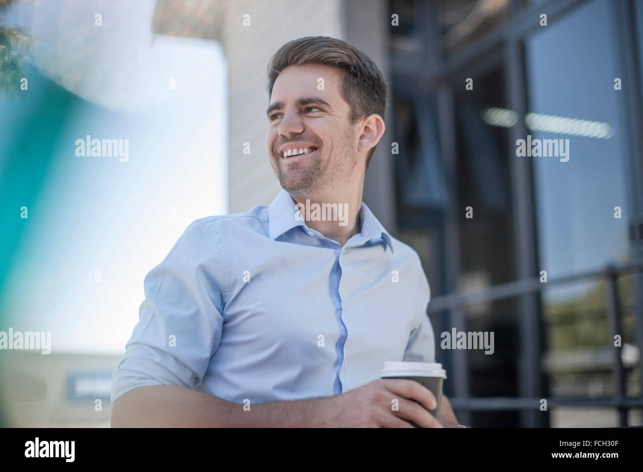 Young man coffee smiling Stock Photo - Alamy