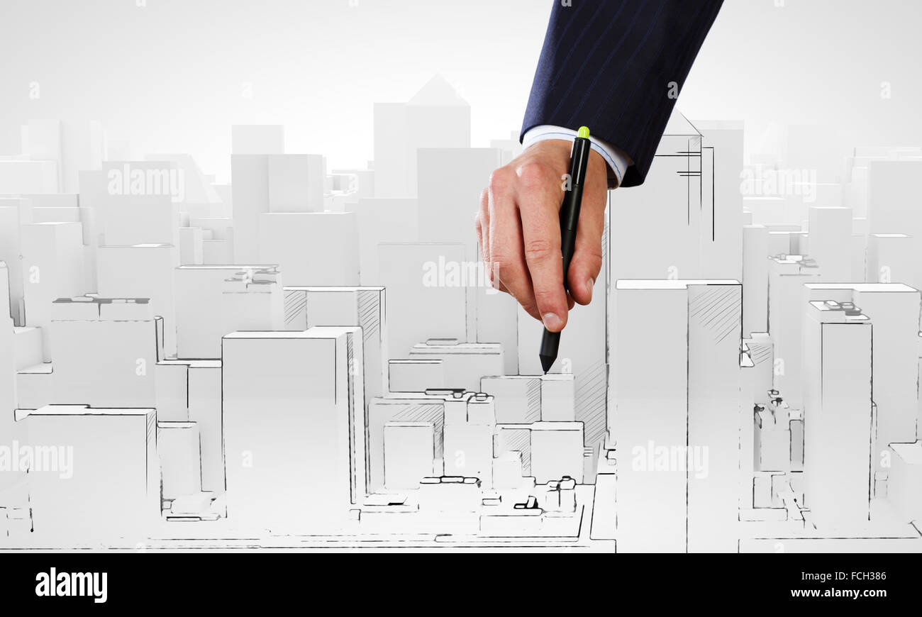 Close up of human hand drawing construction project Stock Photo - Alamy