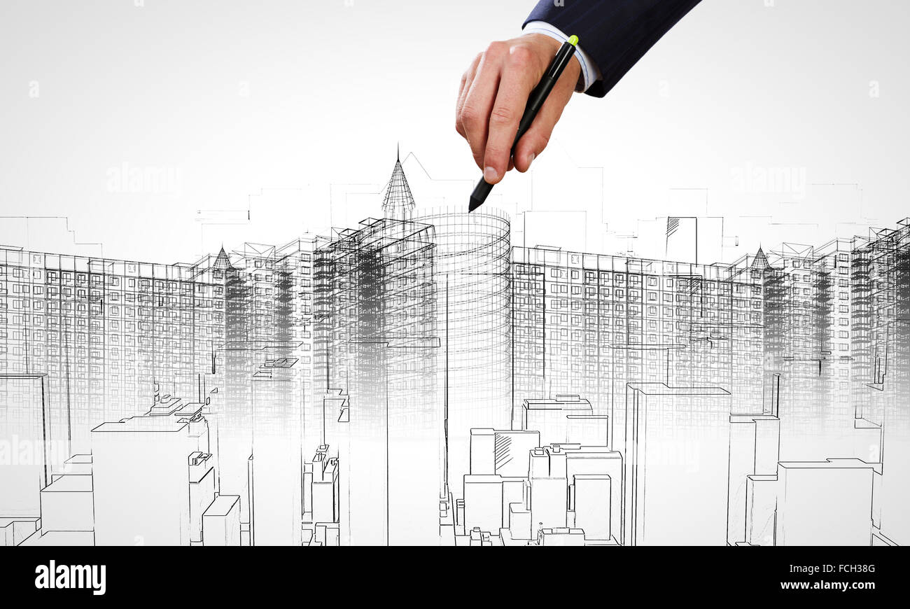 Close up of human hand drawing construction project Stock Photo - Alamy