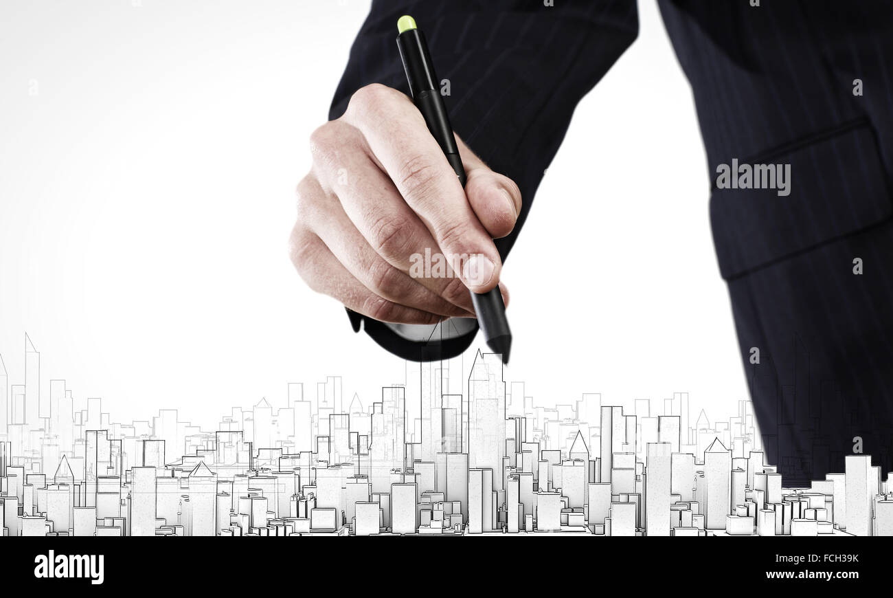 Close up of human hand drawing construction project Stock Photo - Alamy