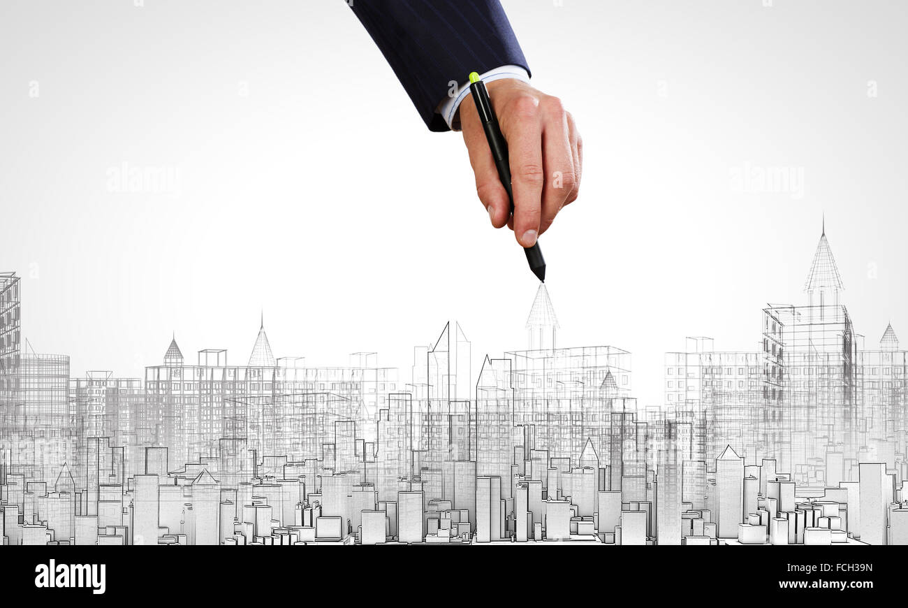 Close up of human hand drawing construction project Stock Photo - Alamy