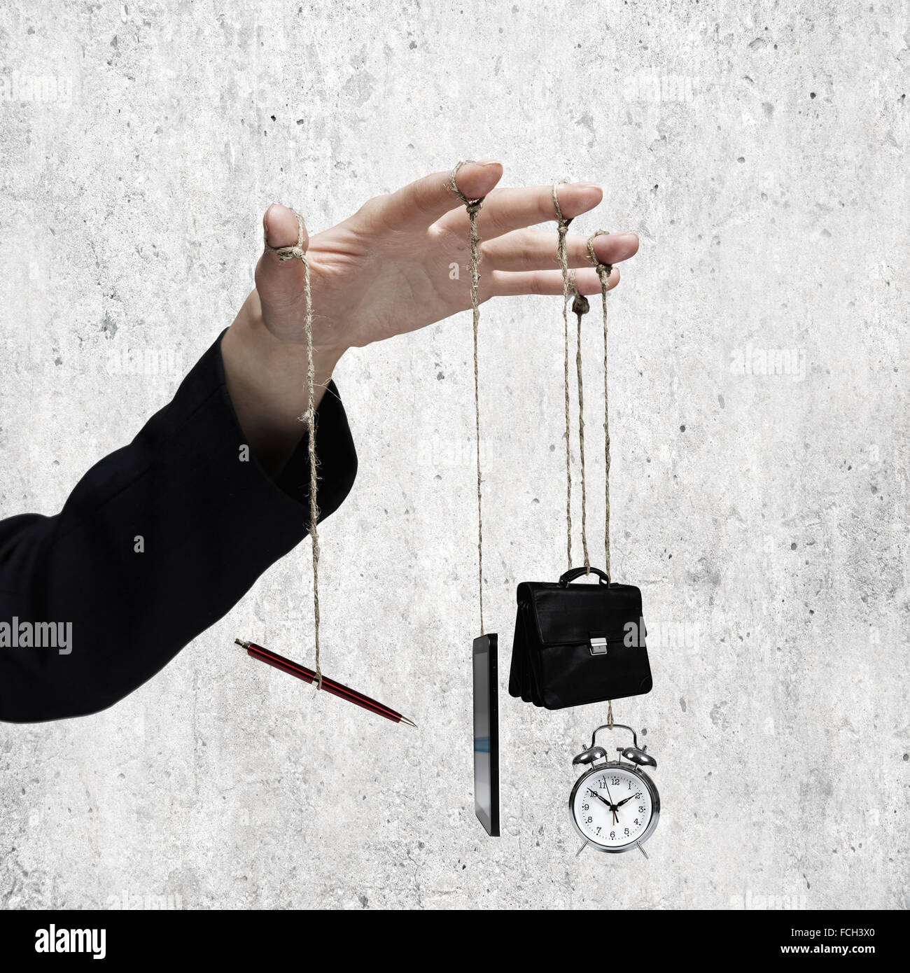 Close up of business person hand holding office items on rope Stock ...