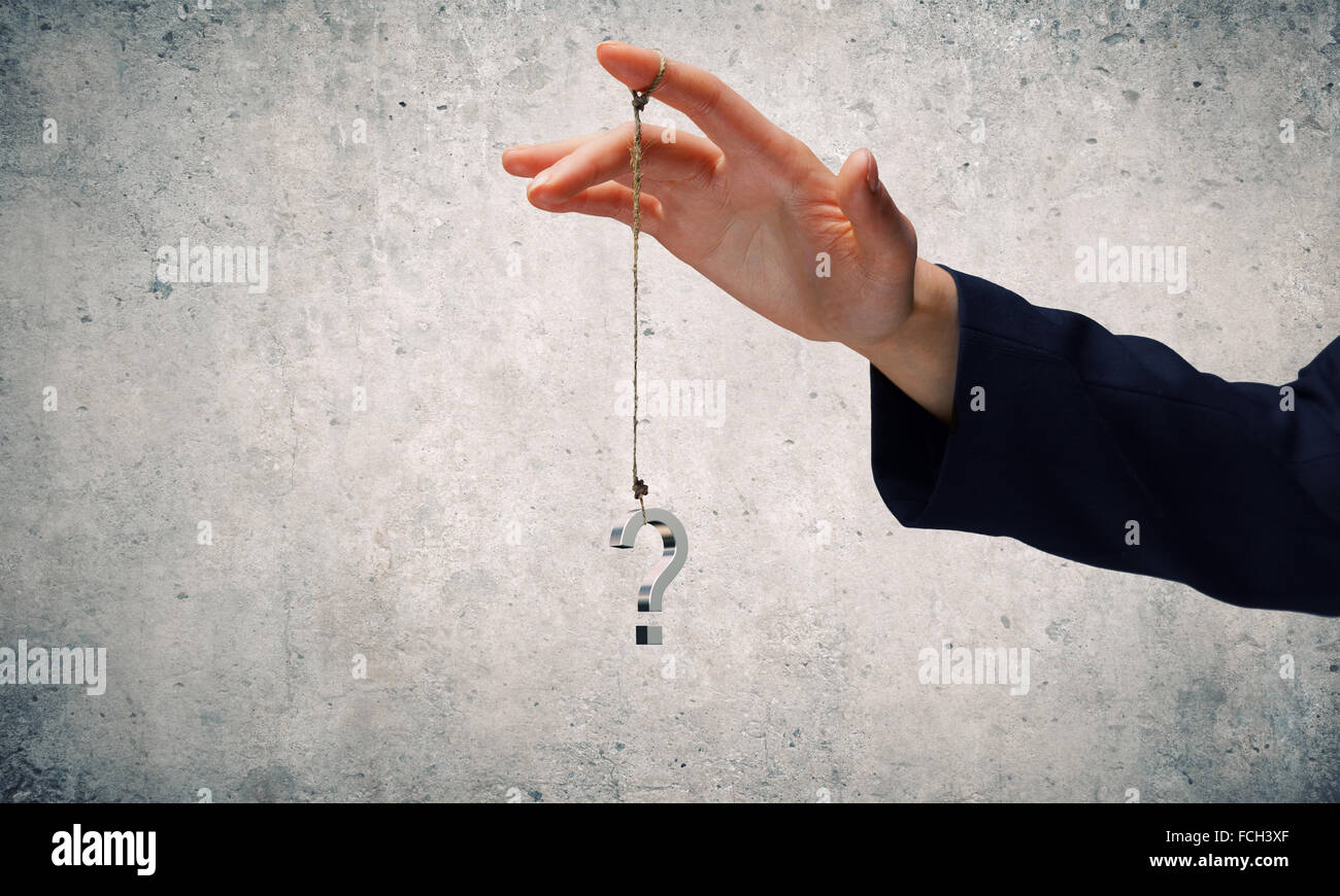 Close up of businessman hand and question sign hanging on finger Stock ...