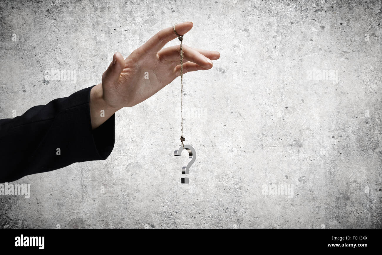 Close up of businessman hand and question sign hanging on finger Stock ...