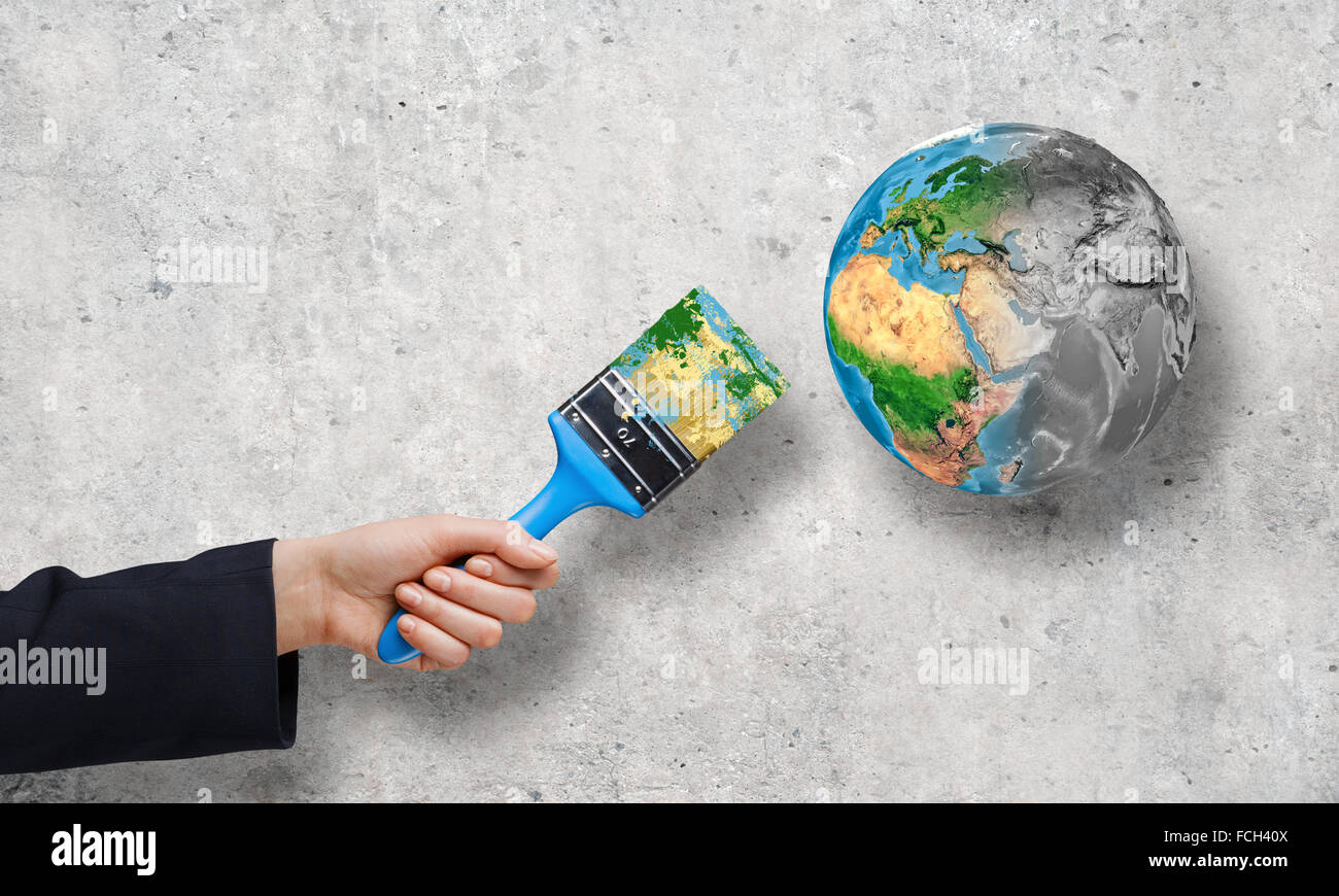 Close up of business person hand painting Earth planet. Elements of ...