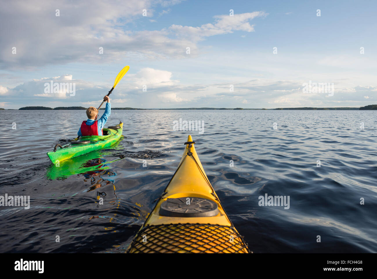 Finland Southern Savonia Oravi Linnansaari National Park boy kayaking ...