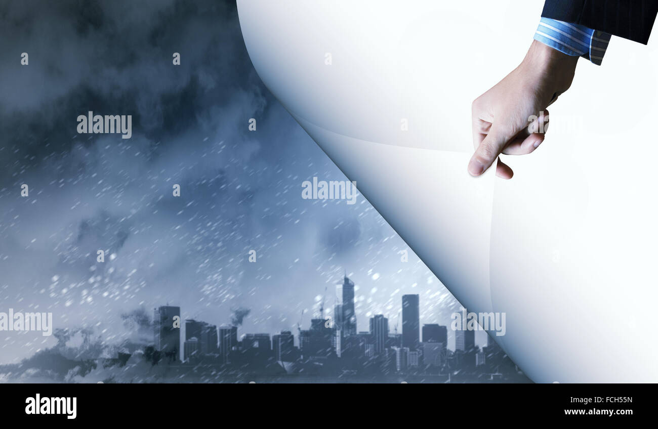 Close up of hand turning white sheet of paper Stock Photo - Alamy