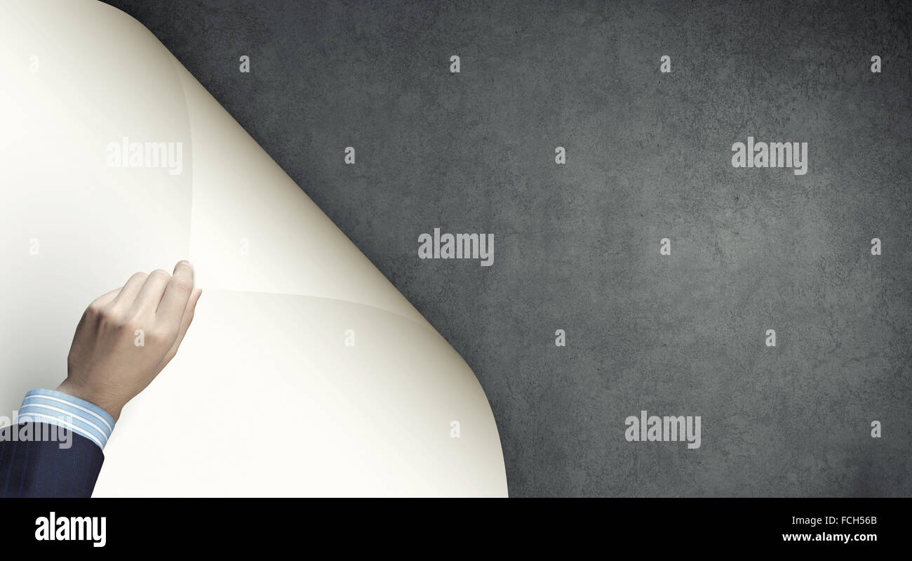 Human hand turning white blank paper page Stock Photo - Alamy