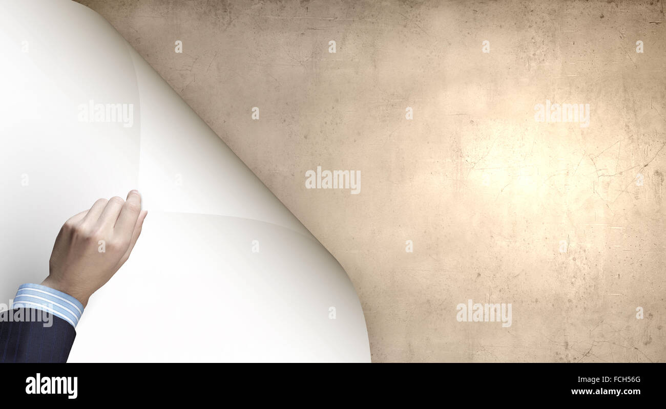 Human hand turning white blank paper page Stock Photo - Alamy