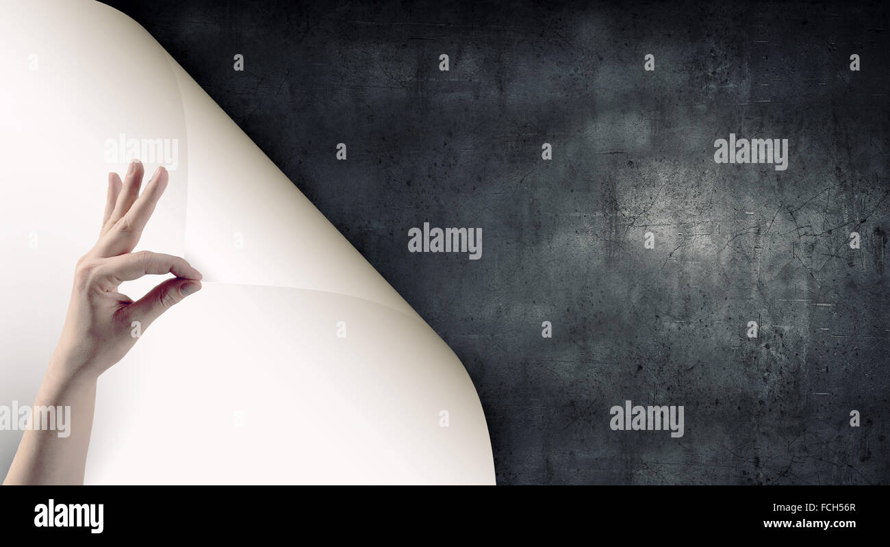 Human hand turning white blank paper page Stock Photo - Alamy