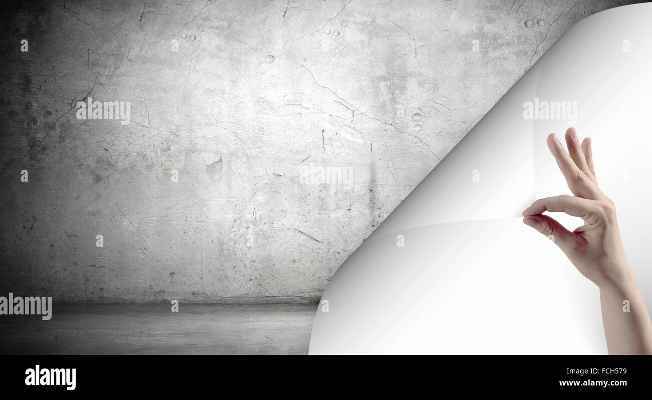 Human hand turning white blank paper page Stock Photo - Alamy