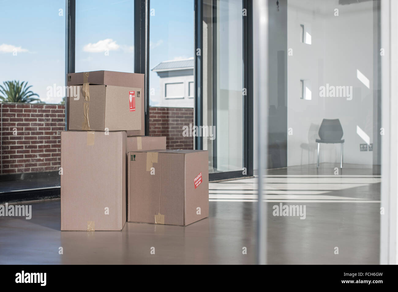 Cardboard boxes in new office Stock Photo - Alamy