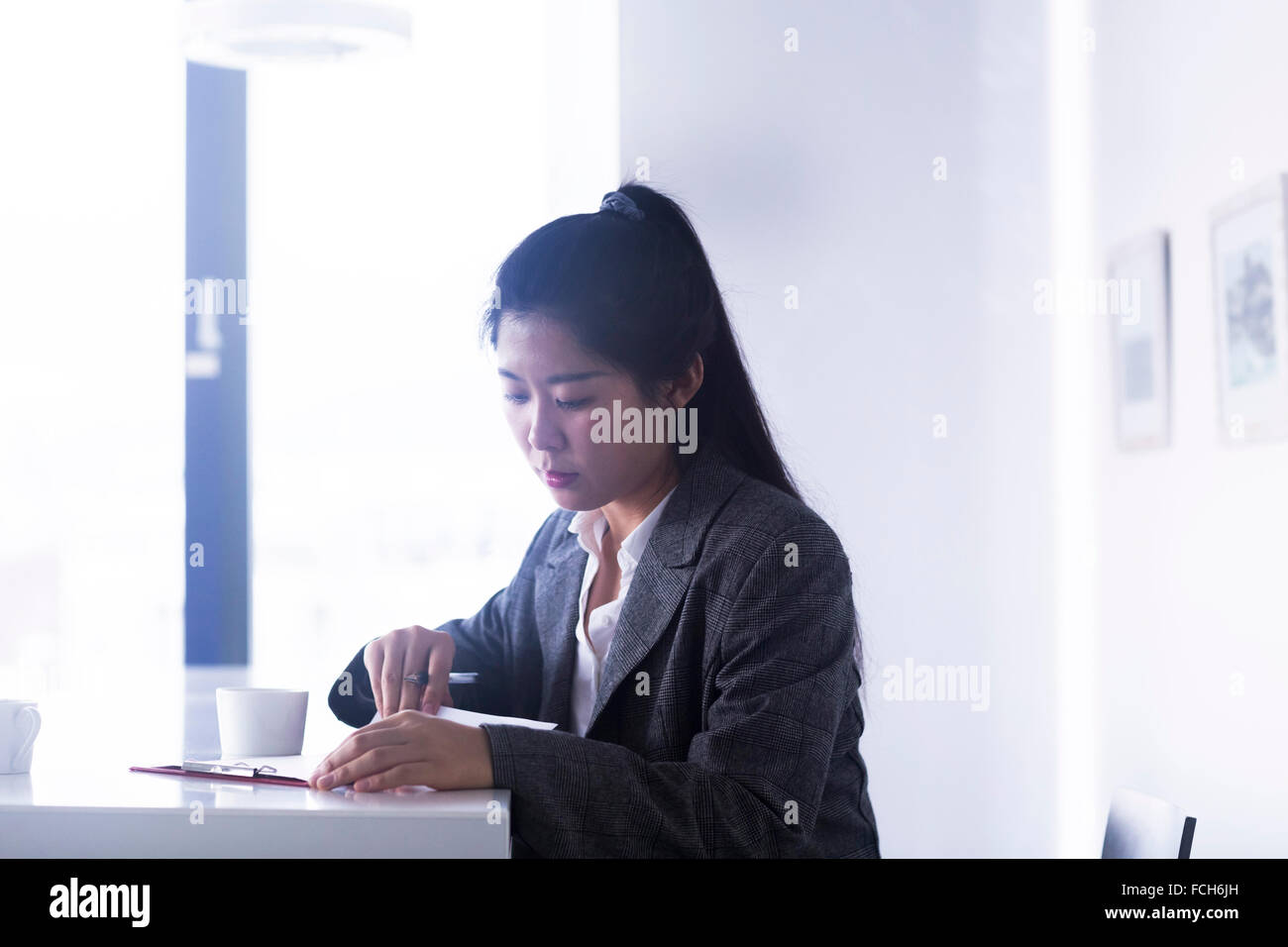 Chinese office worker working in corporate business Stock Photo - Alamy