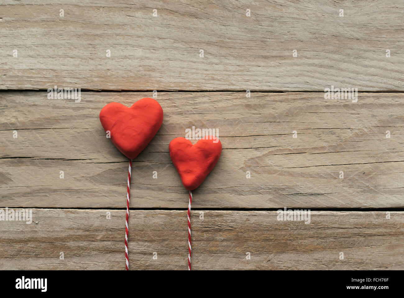 Two hearts on wood Stock Photo - Alamy
