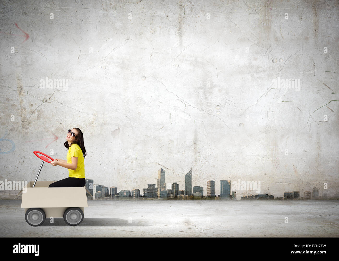 Young funny woman riding in carton box Stock Photo - Alamy