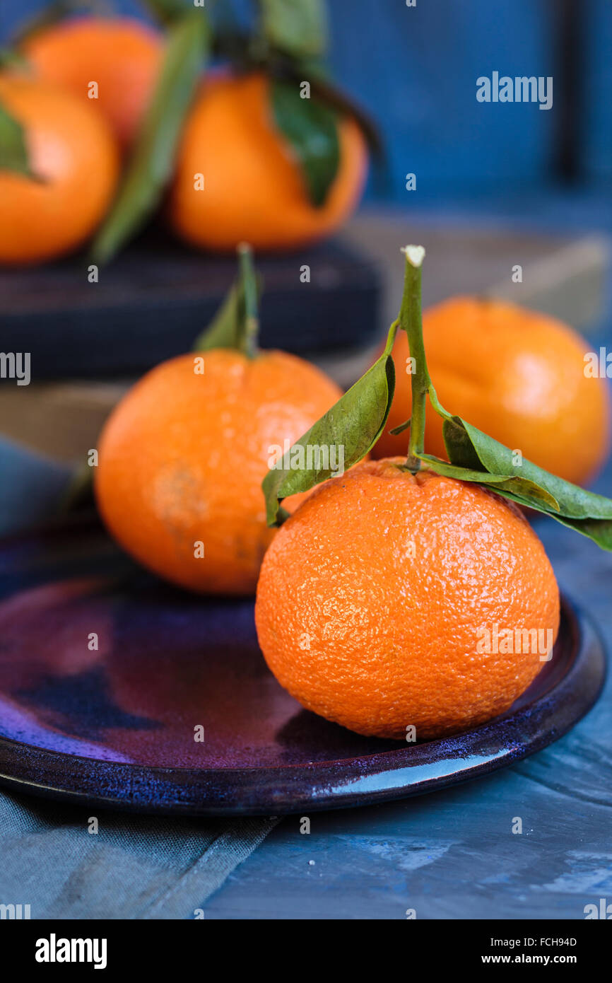 Clementines on plate Stock Photo - Alamy