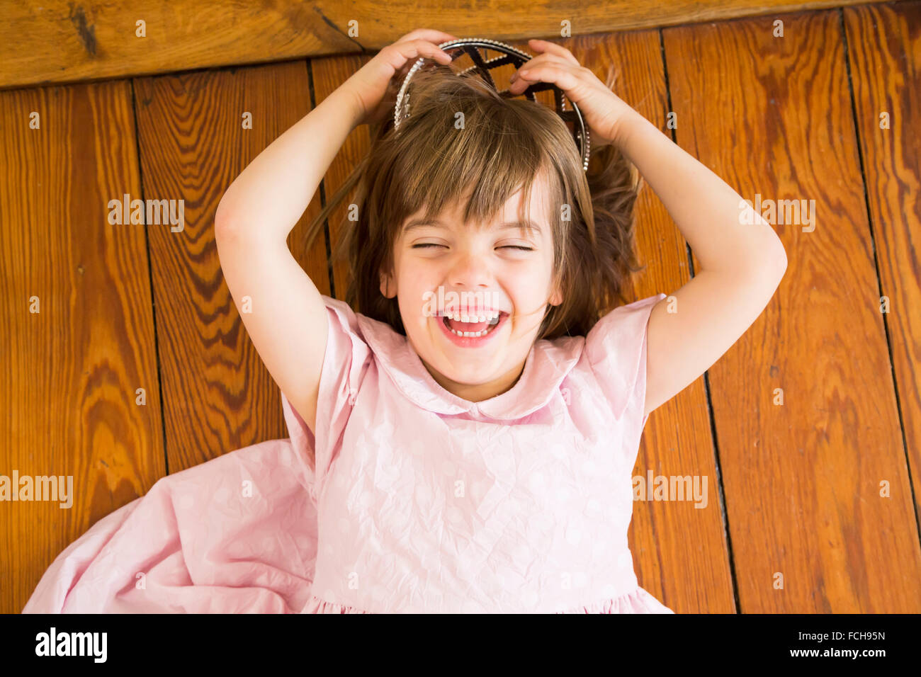 Portrait of laughing little girl dressed up as a princess Stock Photo ...