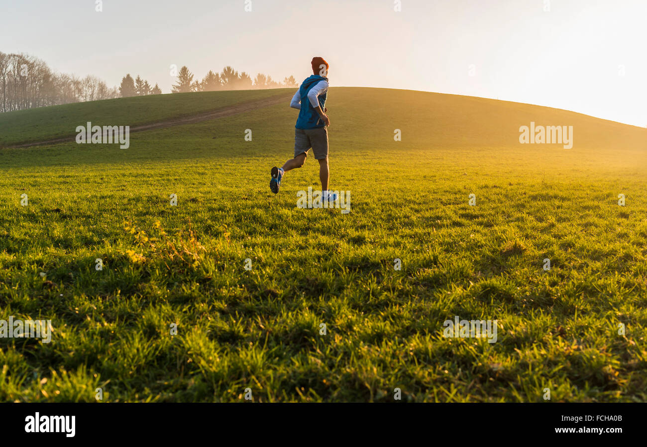 Young man jogging in the morning Stock Photo - Alamy
