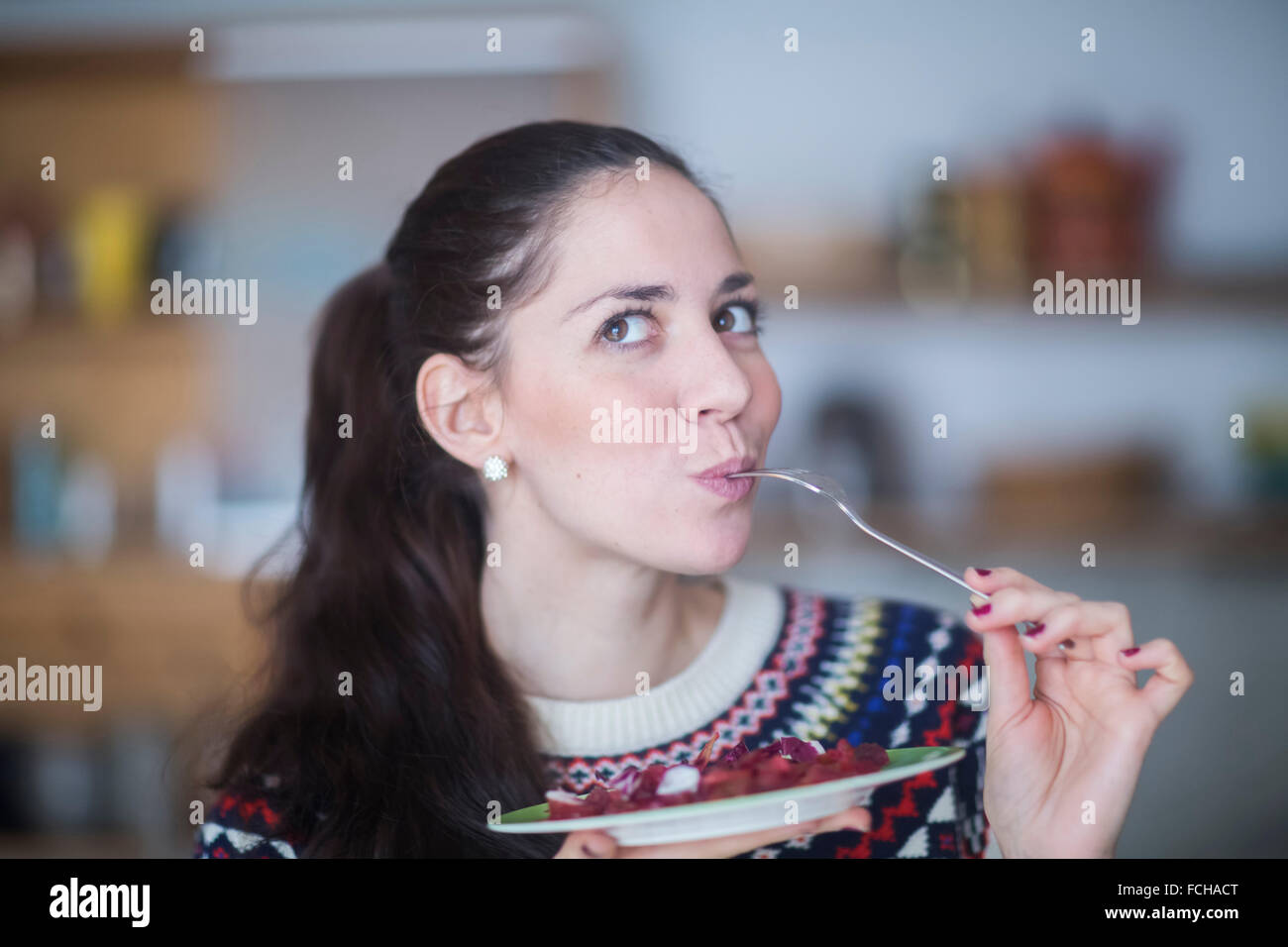 Portrait of eating woman Stock Photo - Alamy