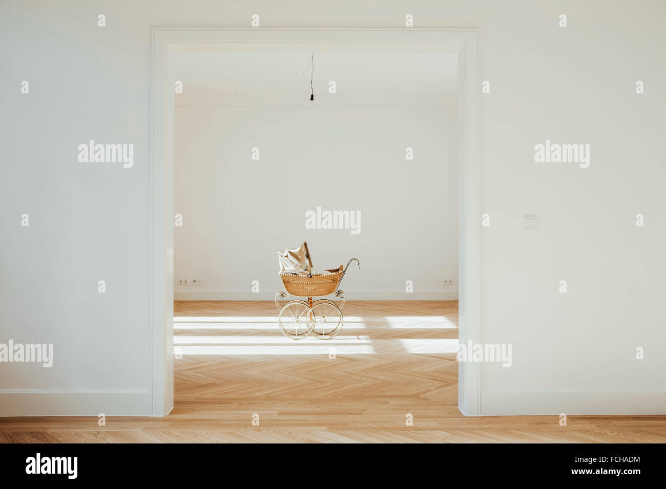 Pram in empty room open doors Stock Photo - Alamy