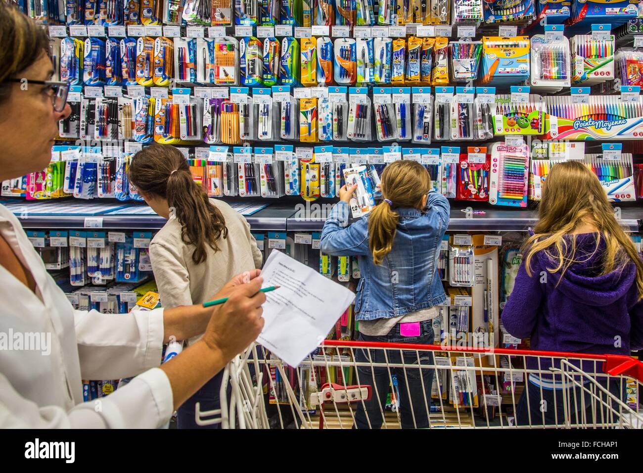 BACK-TO-SCHOOL ILLUSTRATION, BUYING SCHOOL SUPPLIES AT A SUPERMARKET ...