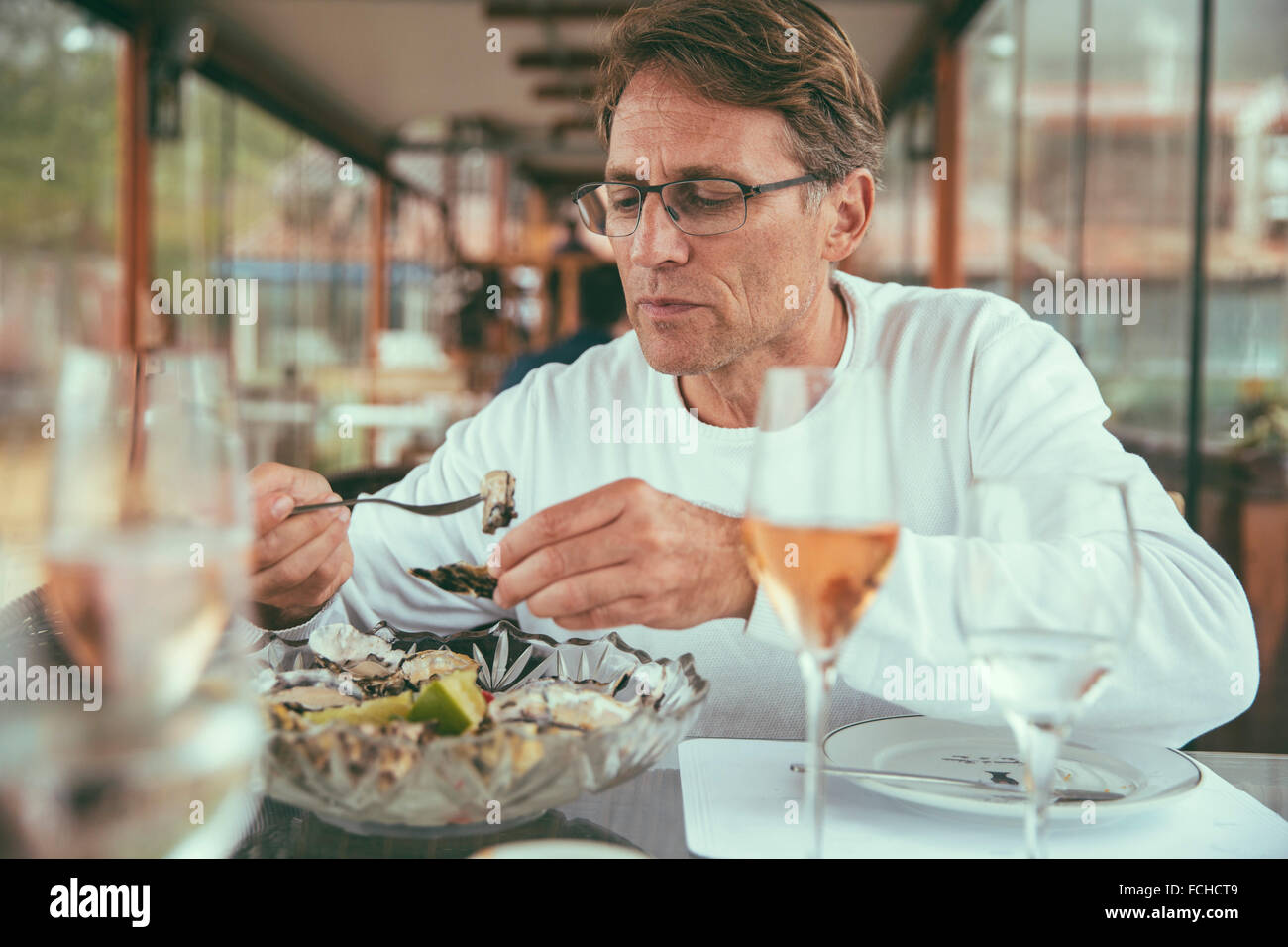 Man eating oysters not woman hi-res stock photography and images - Alamy