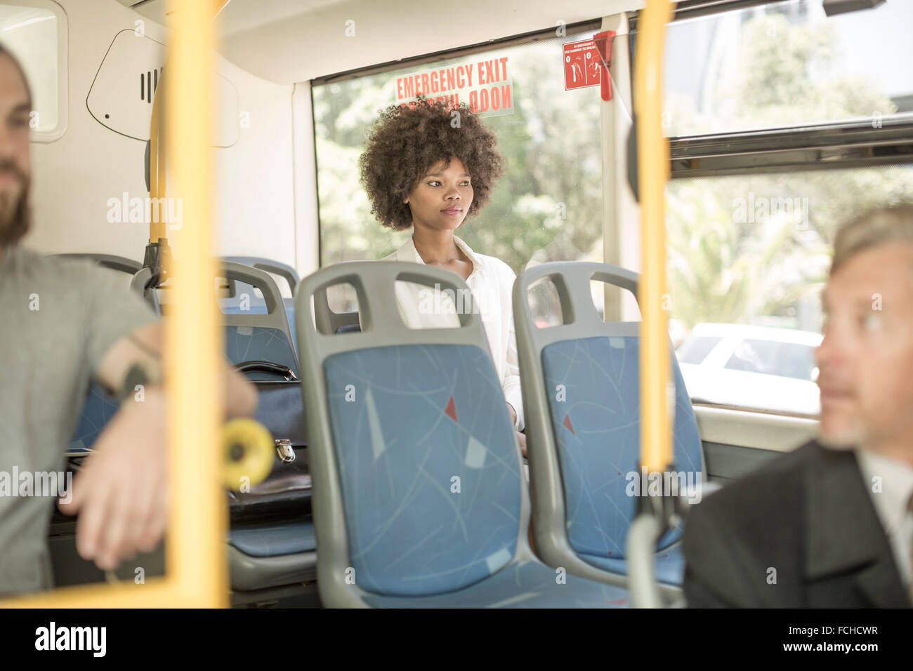 People riding in city bus Stock Photo - Alamy