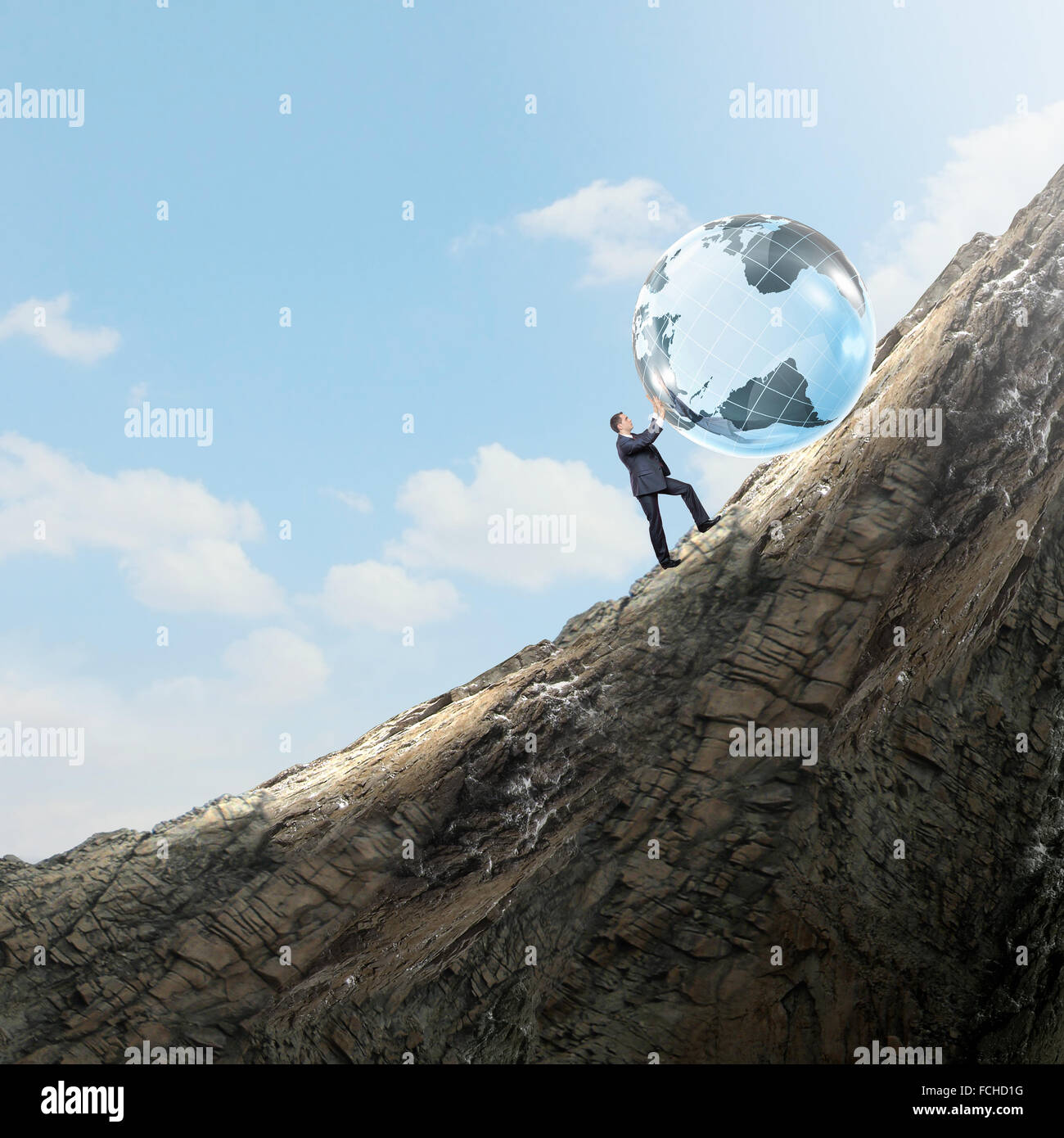 Businessman rolling Earth planet up the hill Stock Photo - Alamy