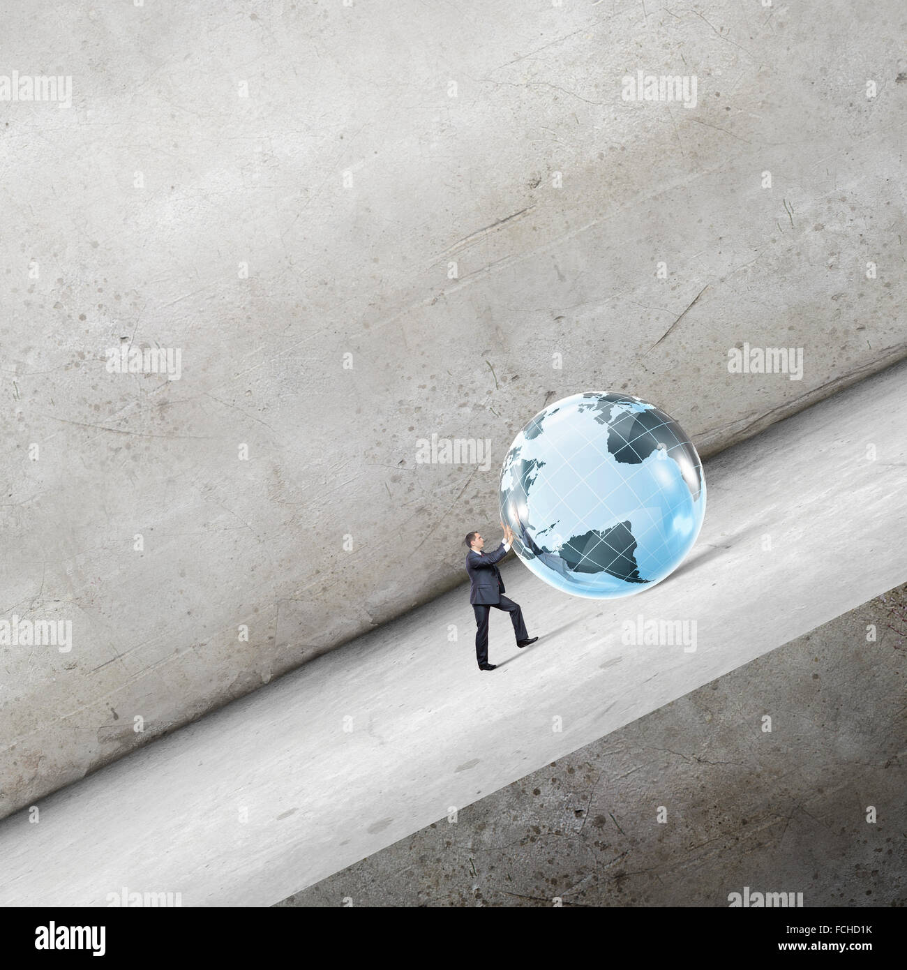 Businessman rolling Earth planet up the hill Stock Photo - Alamy